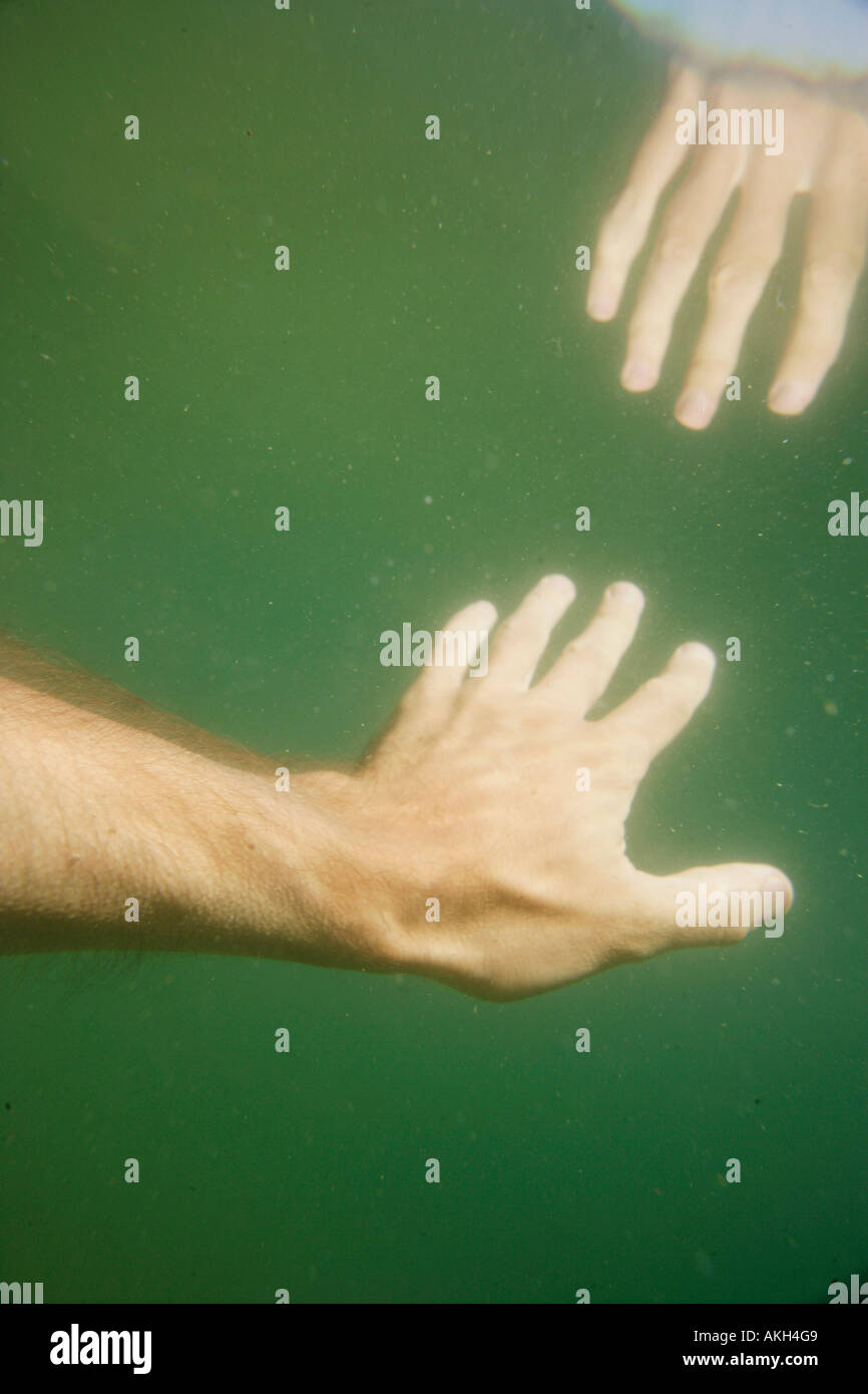 hand in water and a reflection of it Stock Photo - Alamy