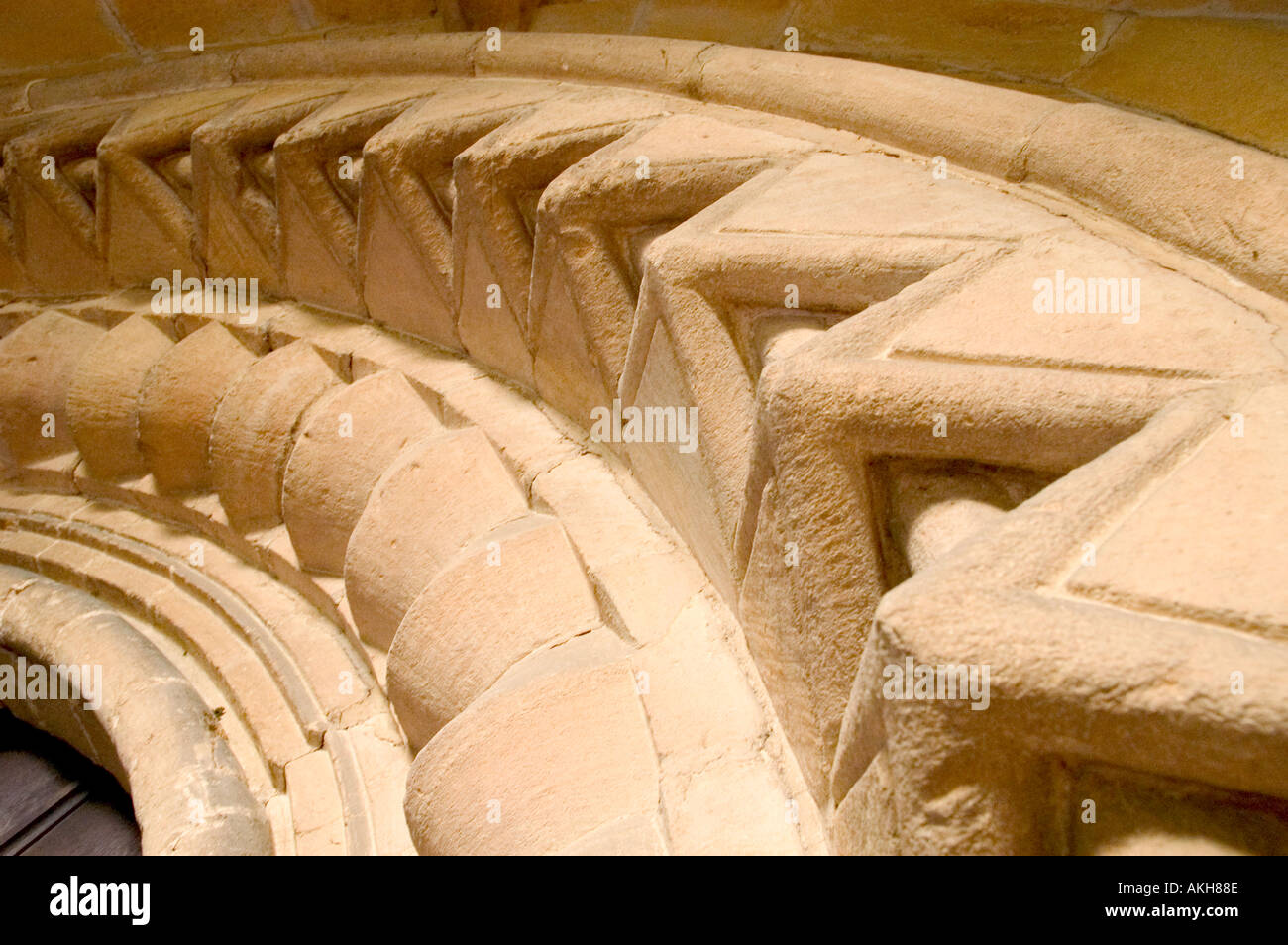 Saxon tiger tooth pattern on church entrance Stock Photo - Alamy