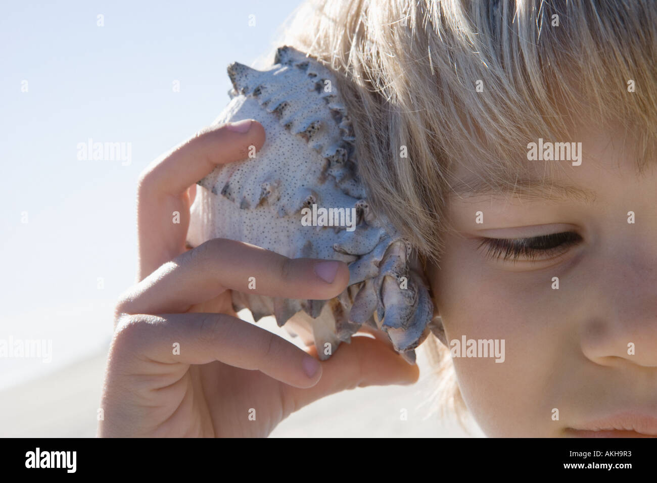 Child shell ear hi-res stock photography and images - Alamy