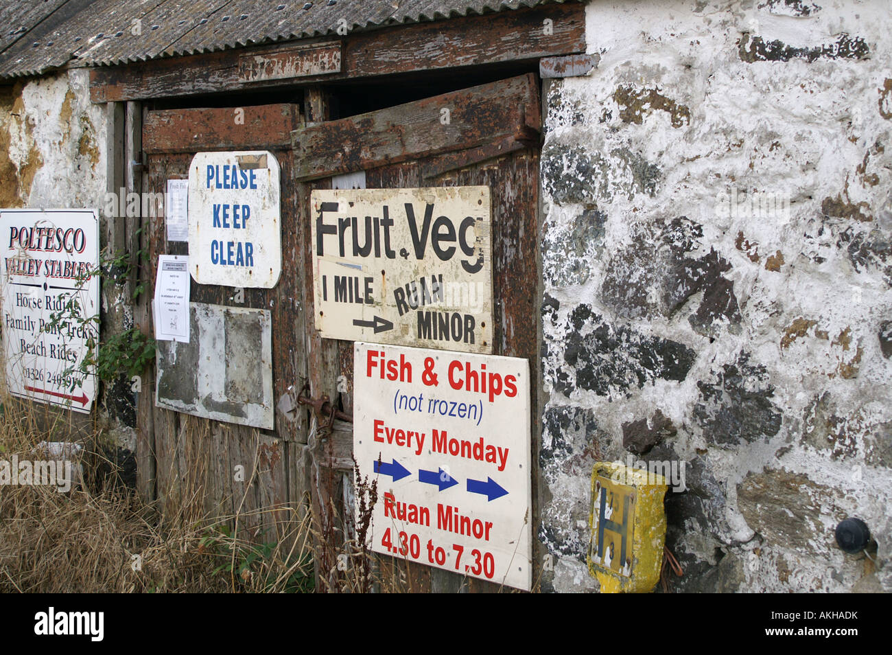 Dilapidated barn corrugated roof weatherbeaten whitewash signs ...