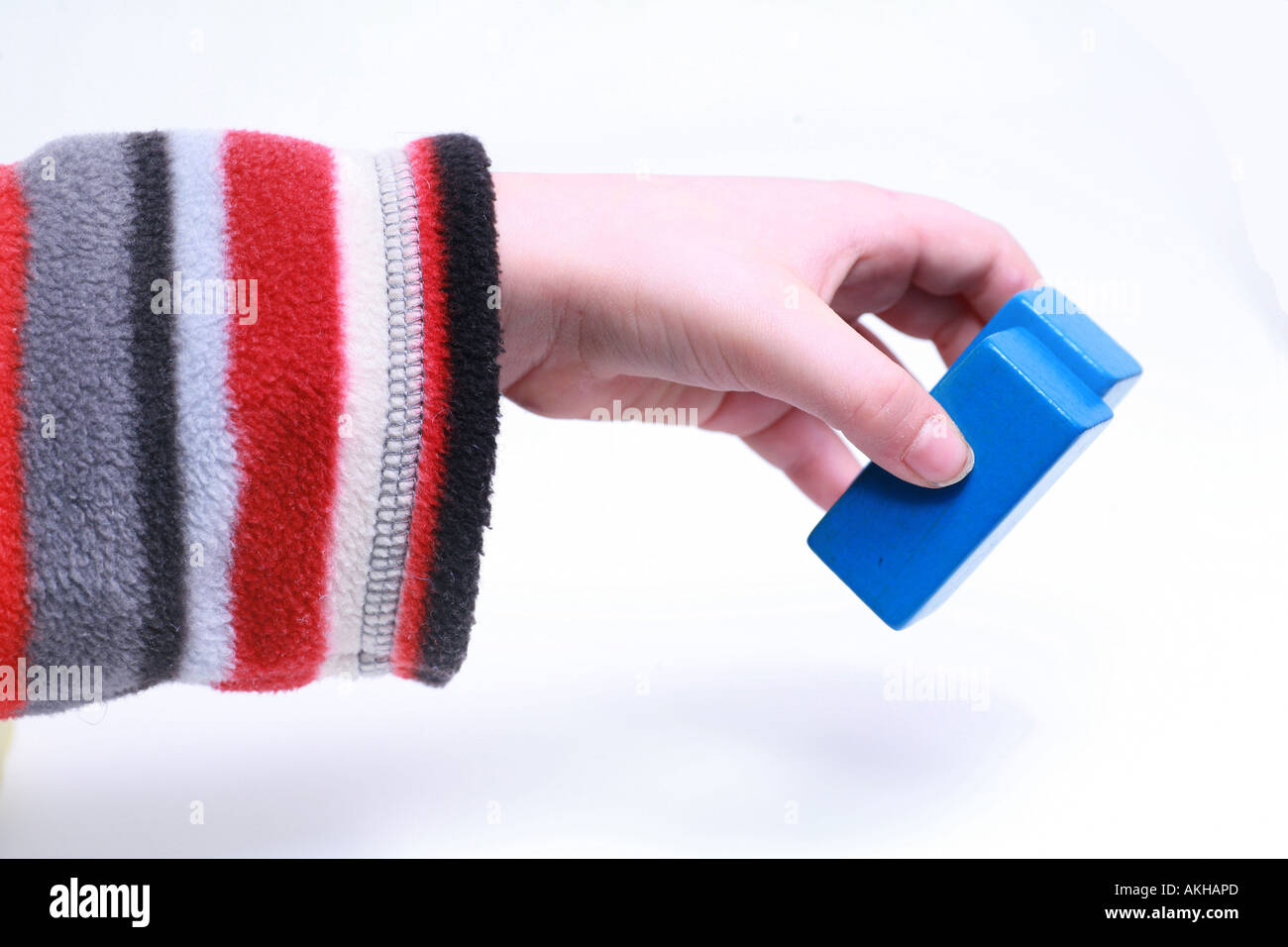 kid hands playing with wooden toys isolated background Stock Photo - Alamy