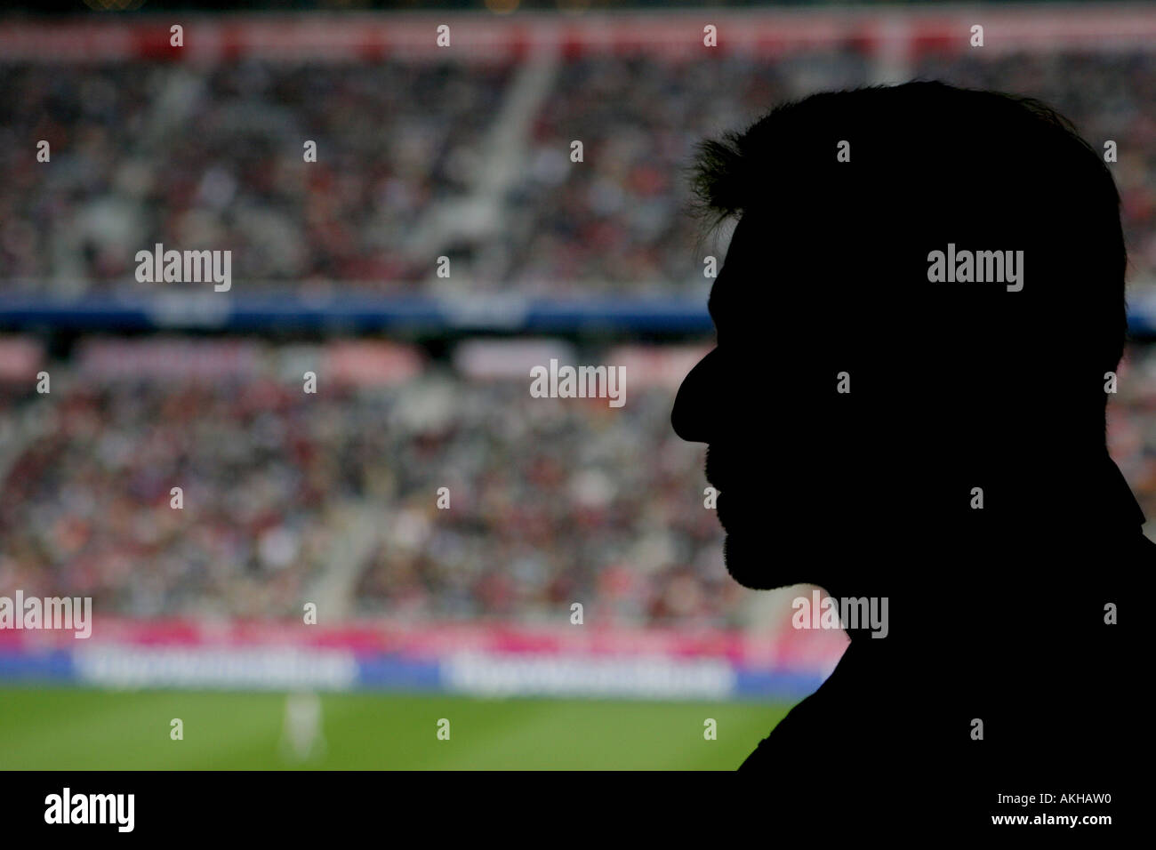 People watching a sports game in a stadion Stock Photo - Alamy
