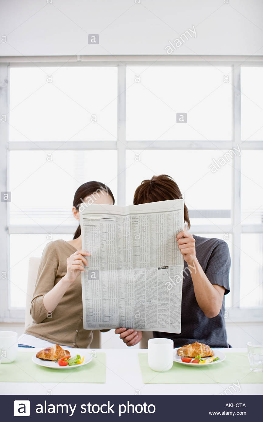 Hiding Behind Newspaper Stock Photos & Hiding Behind Newspaper Stock ...