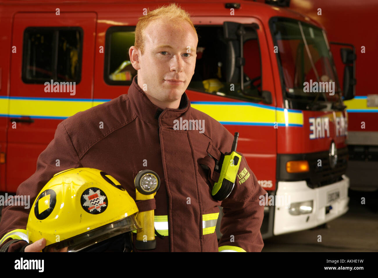 Portrait of London Fire Brigade fireman Dan Savva in front of fire ...