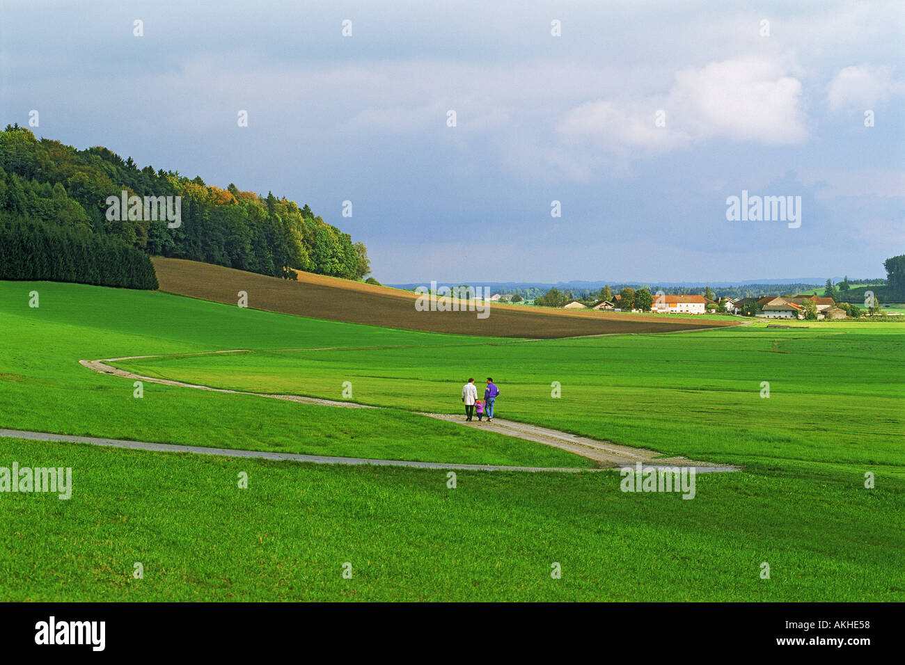 Family walking through Upper Bavaria countryside in Germany Stock Photo ...