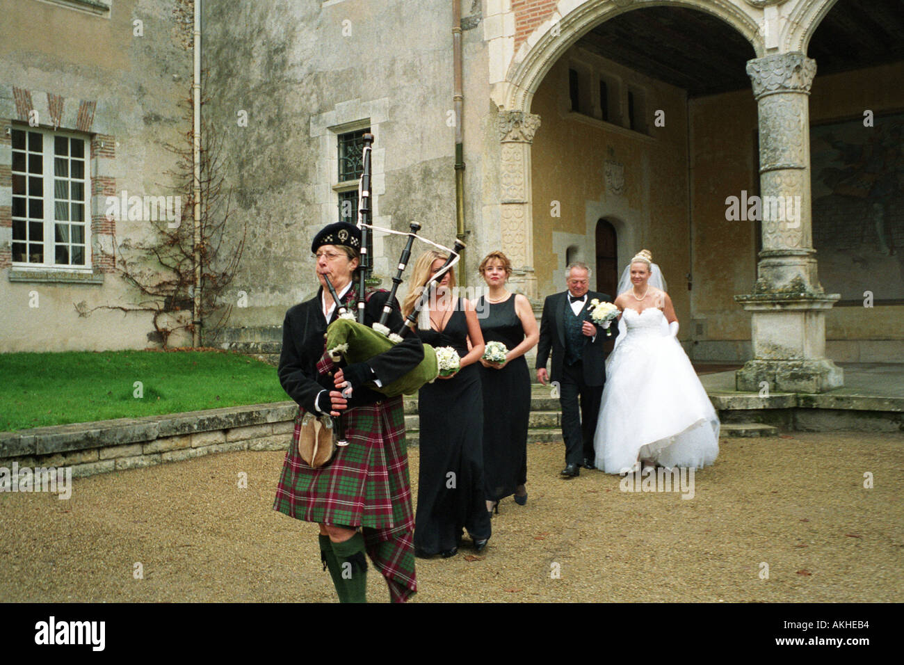 wedding procession at chateau castle la verrerie in france lead by ...