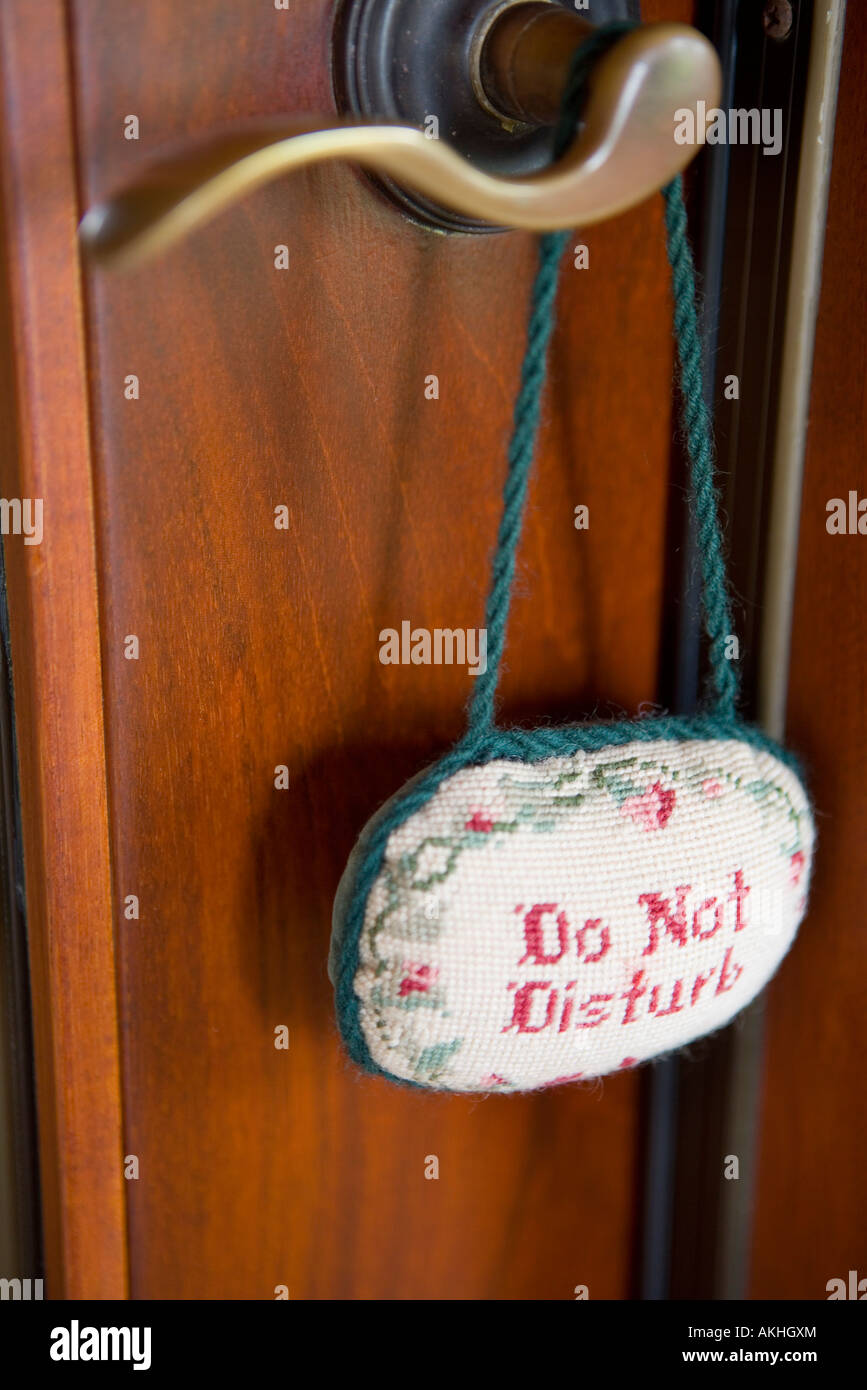 Detail of door handle with do not disturb sign Stock Photo - Alamy
