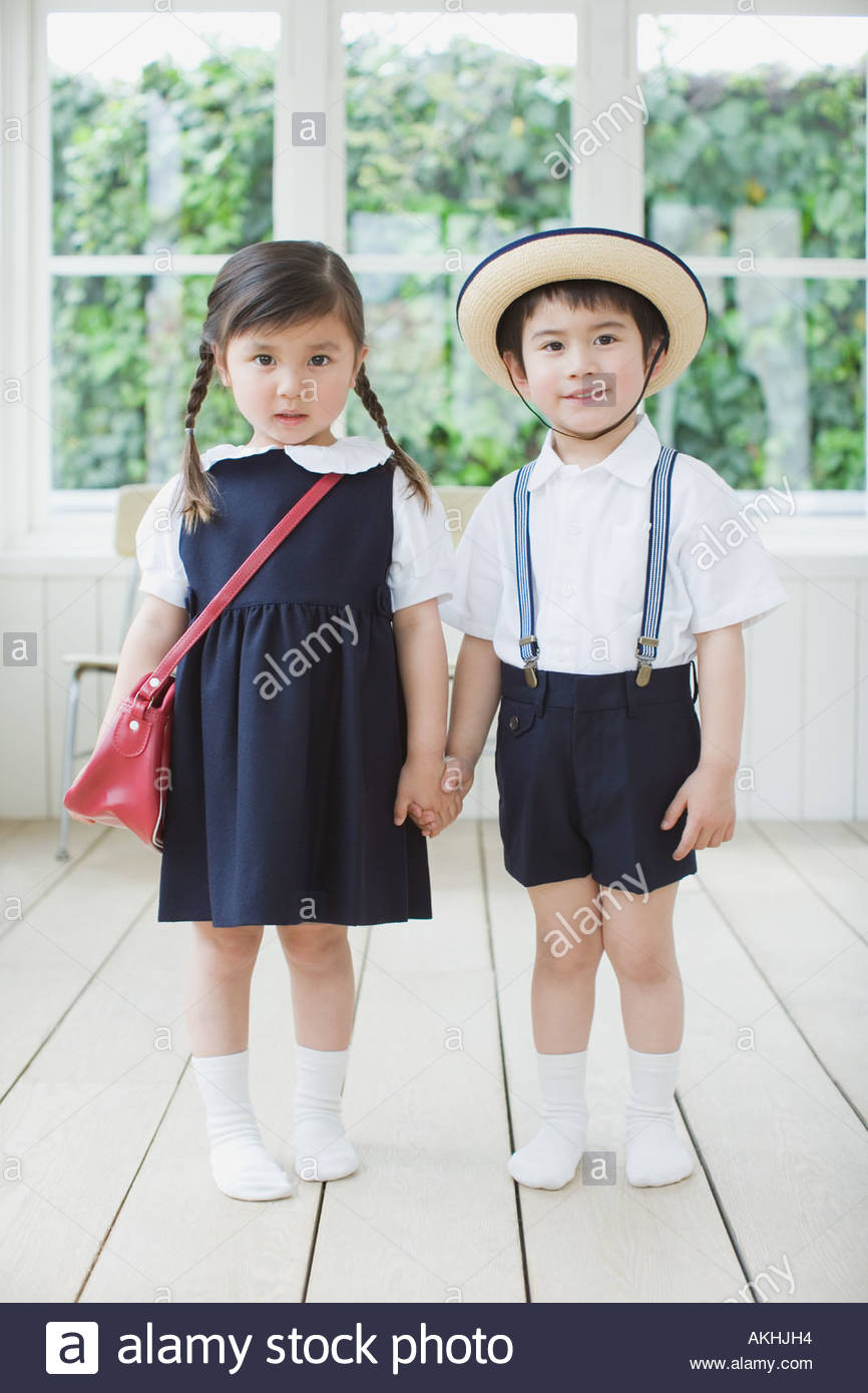 Two children wearing school uniform Stock Photo, Royalty Free Image ...