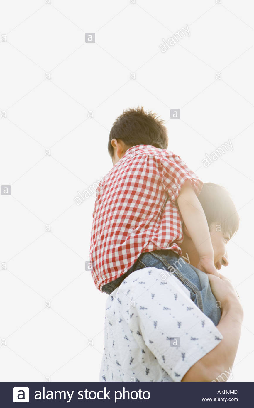 Father Carrying Son On Shoulder Stock Photos & Father Carrying Son On ...