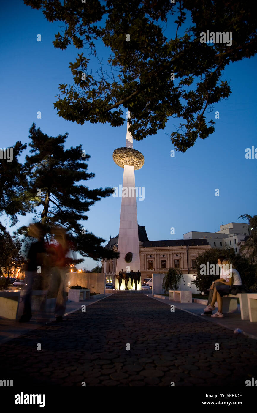Couples at night in revolution square by the Monument of rebirth ...