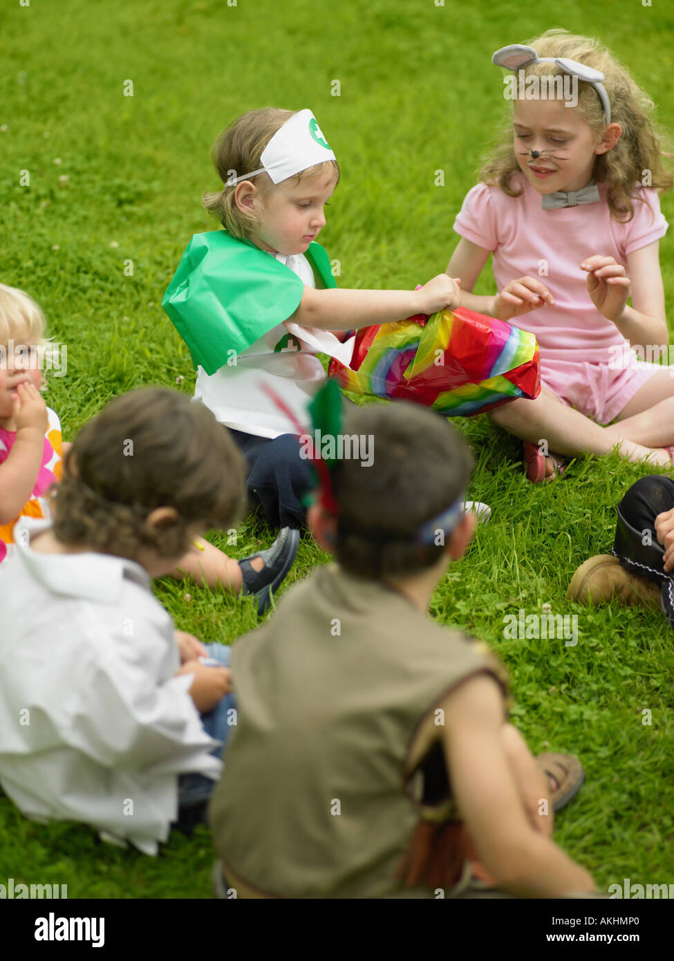 Kids playing pass the parcel Stock Photo - Alamy