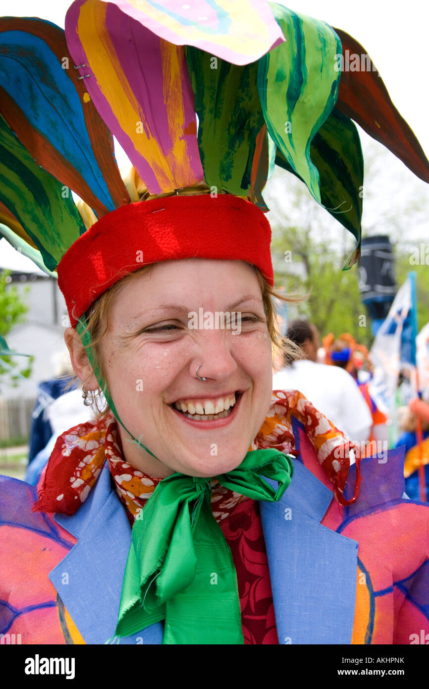 Happy woman age 28 costumed as a colorful flower marching in parade ...