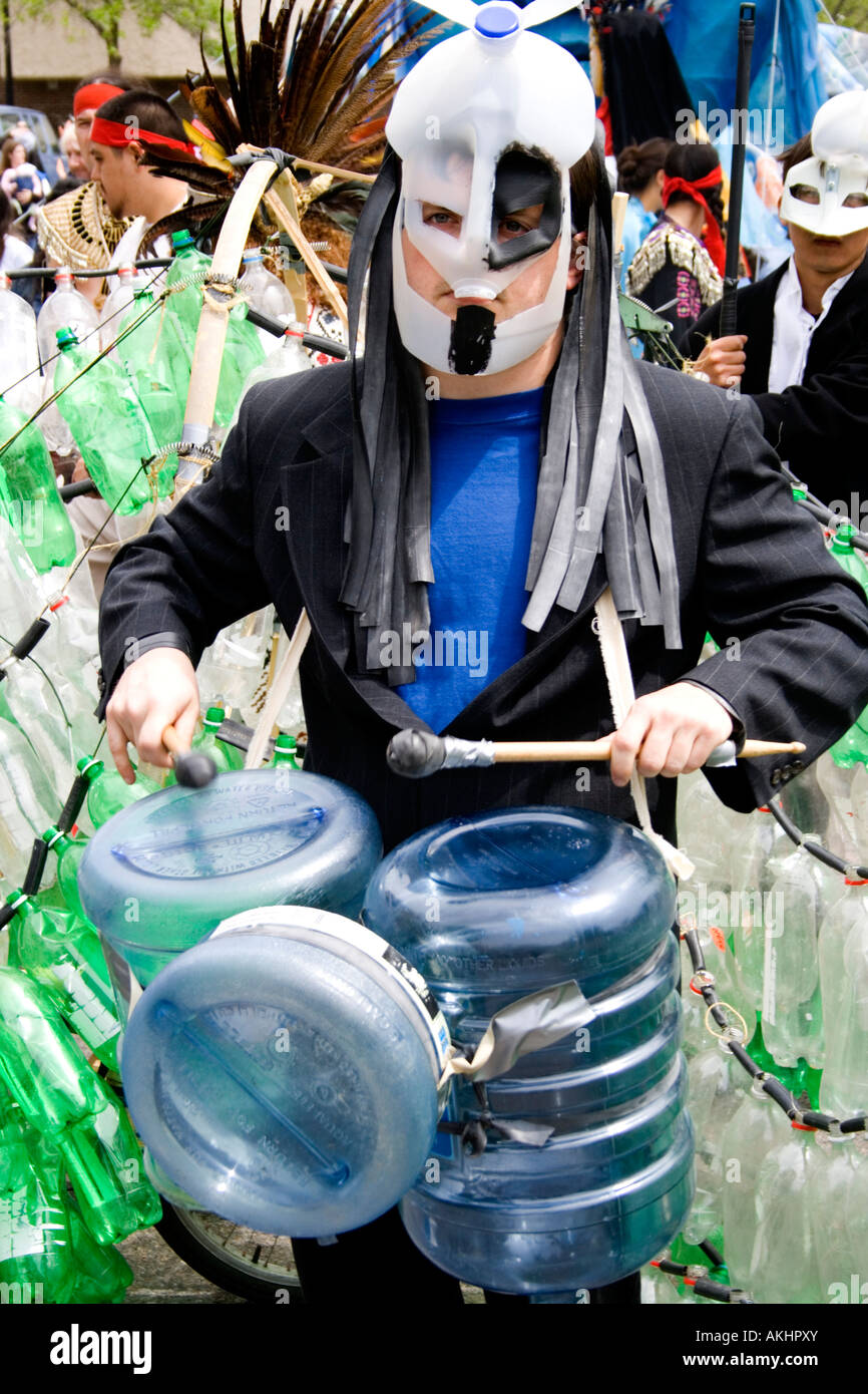 Masked drummer guarding hoarded water from thirsty people of the world ...