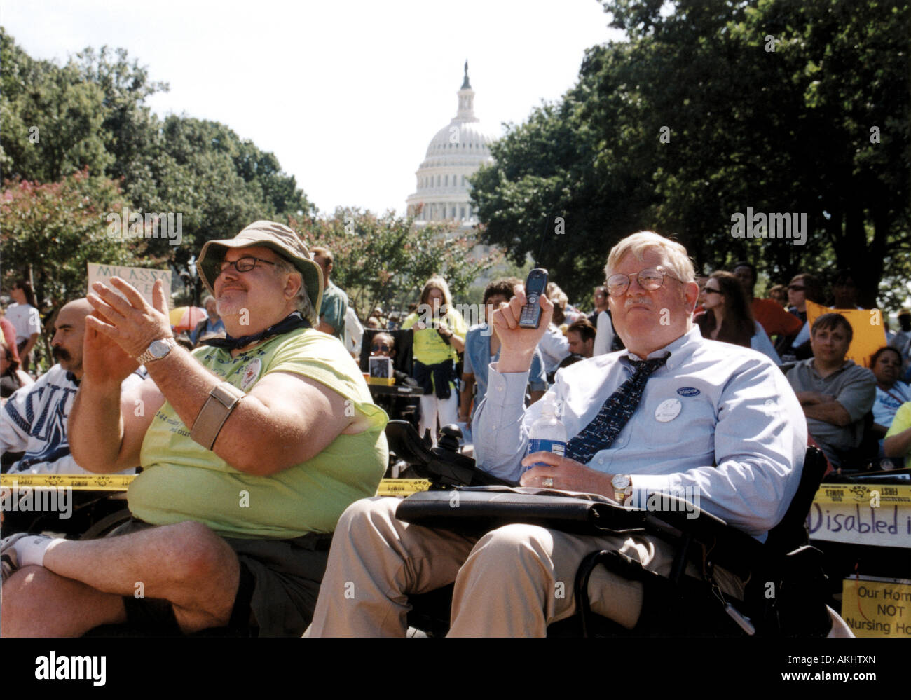 Two older men w/ disabilities participating in a civil rights event for ...