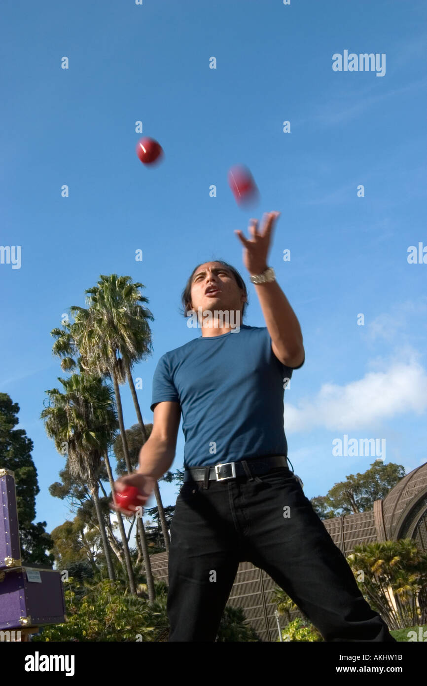 A popular street performer entertains an enthusiastic crowd at a ...