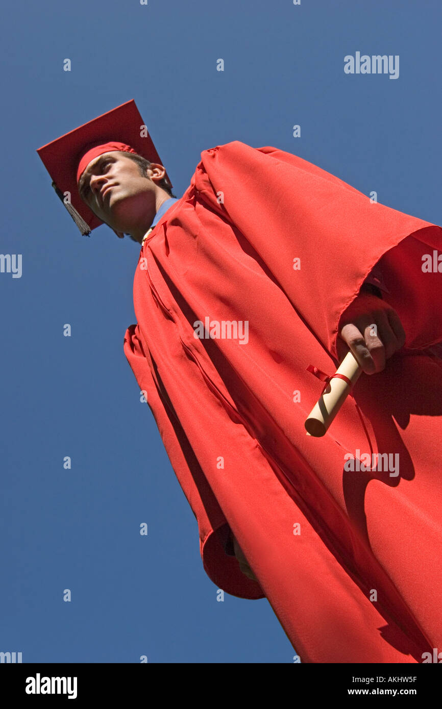 Male graduate in red gown hi-res stock photography and images - Alamy