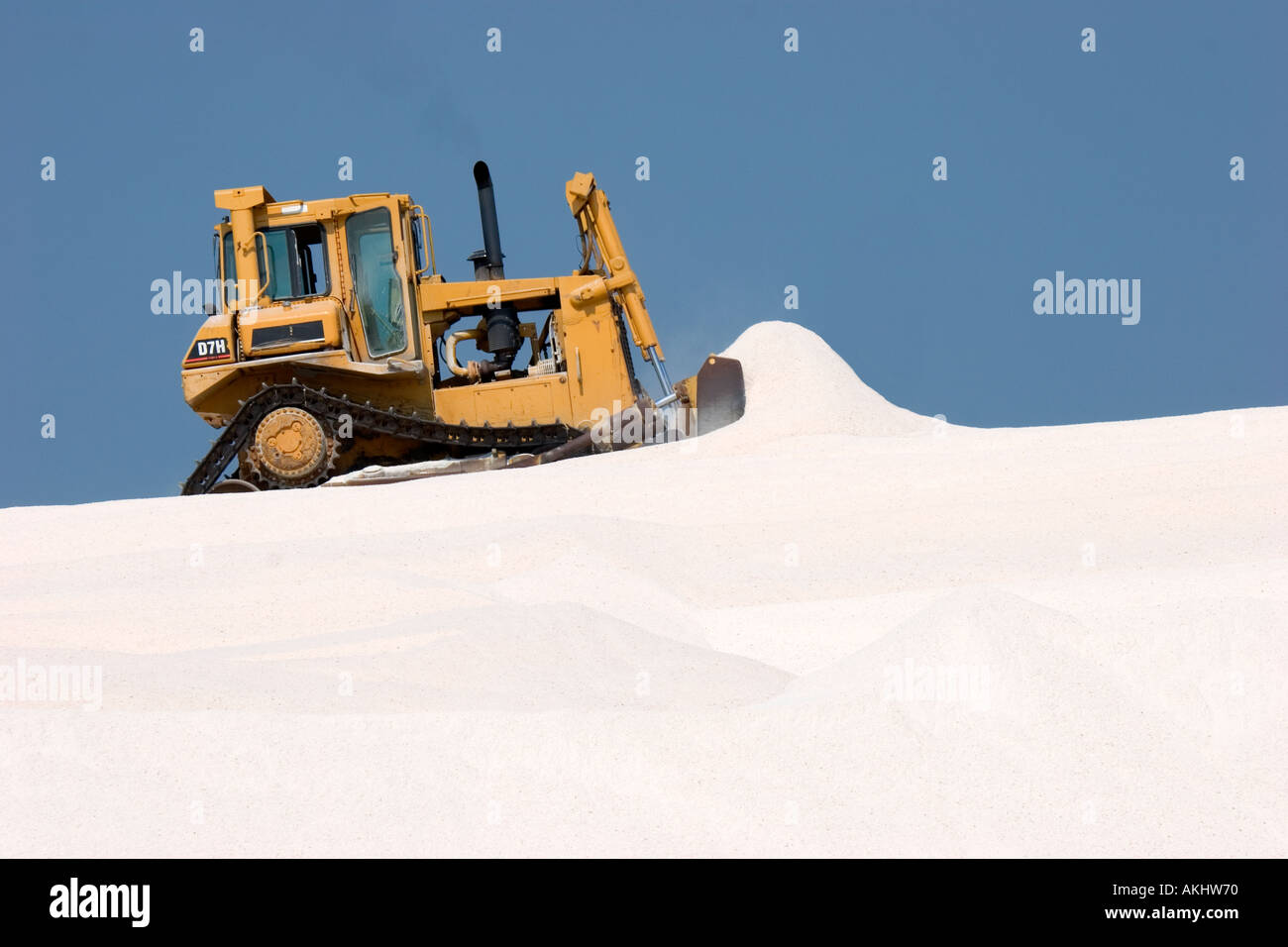 Close up of a hard working bulldozer pushing road salt or snow Stock ...