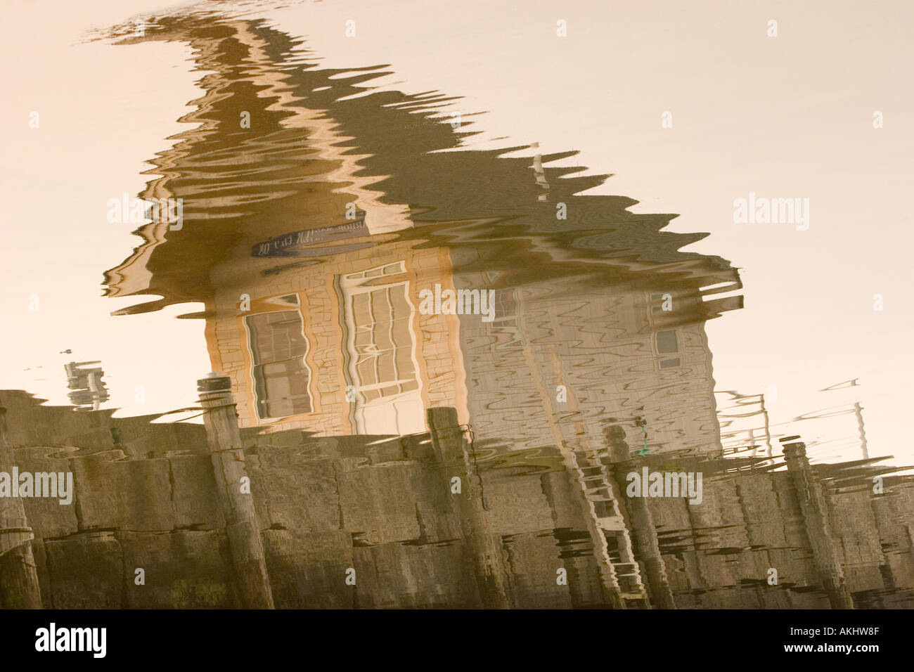 A quaint fishing shack in Maine seen reflected in the water Stock Photo ...