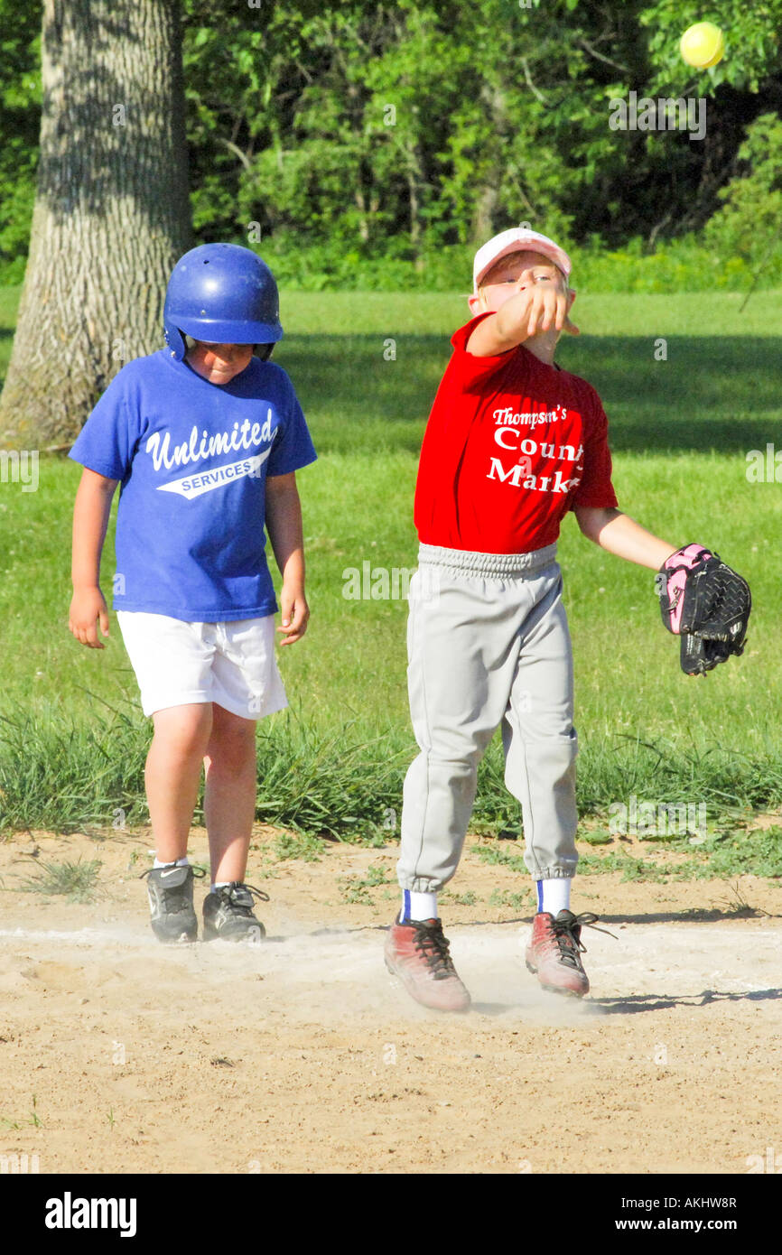 2nd grade school childrens softball practice Stock Photo - Alamy