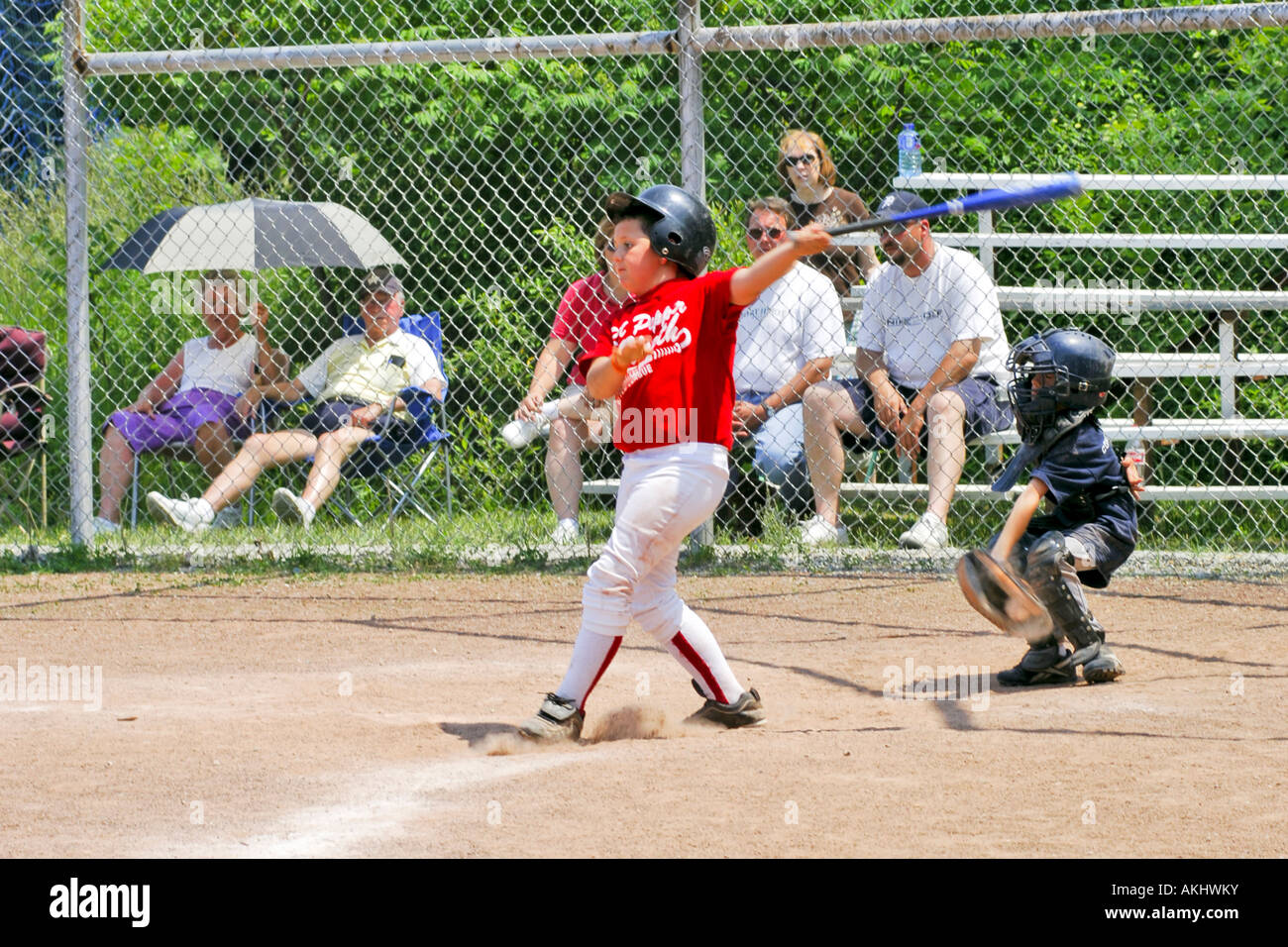 Intense action at a junior league softball game Stock Photo - Alamy