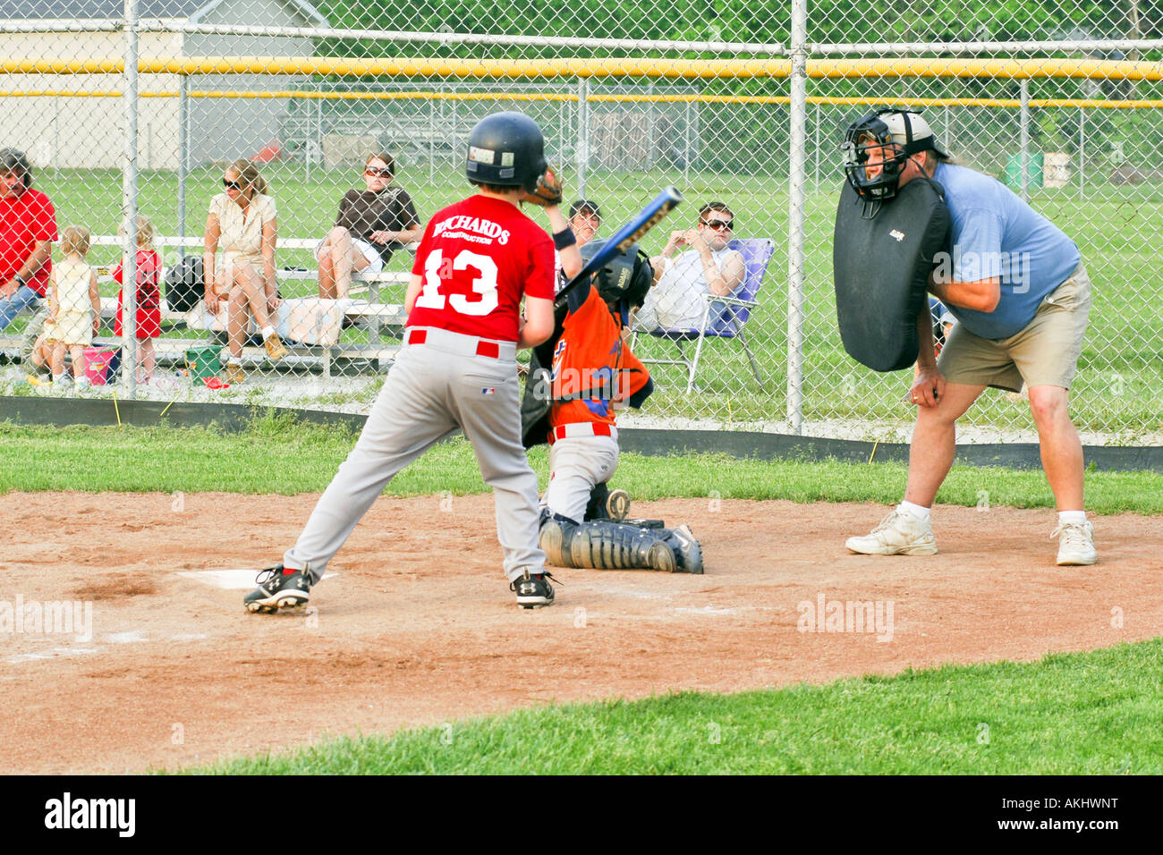 Intense action at a junior league softball game Stock Photo - Alamy