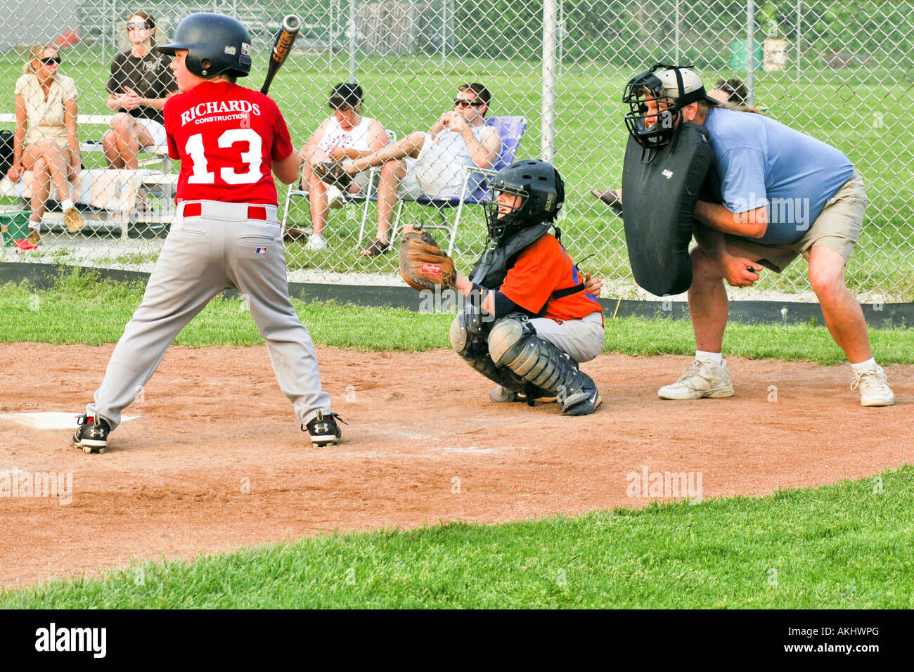 Intense action at a junior league softball game Stock Photo - Alamy