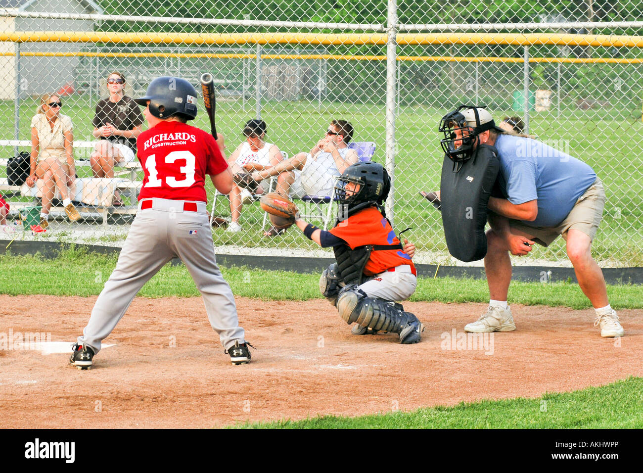 Intense action at a junior league softball game Stock Photo - Alamy