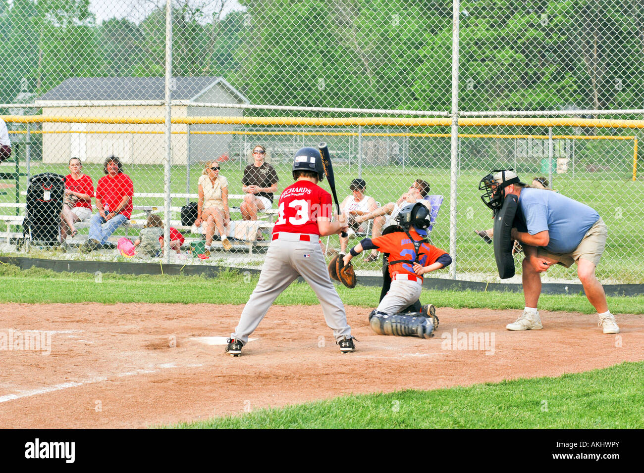 Intense action at a junior league softball game Stock Photo - Alamy