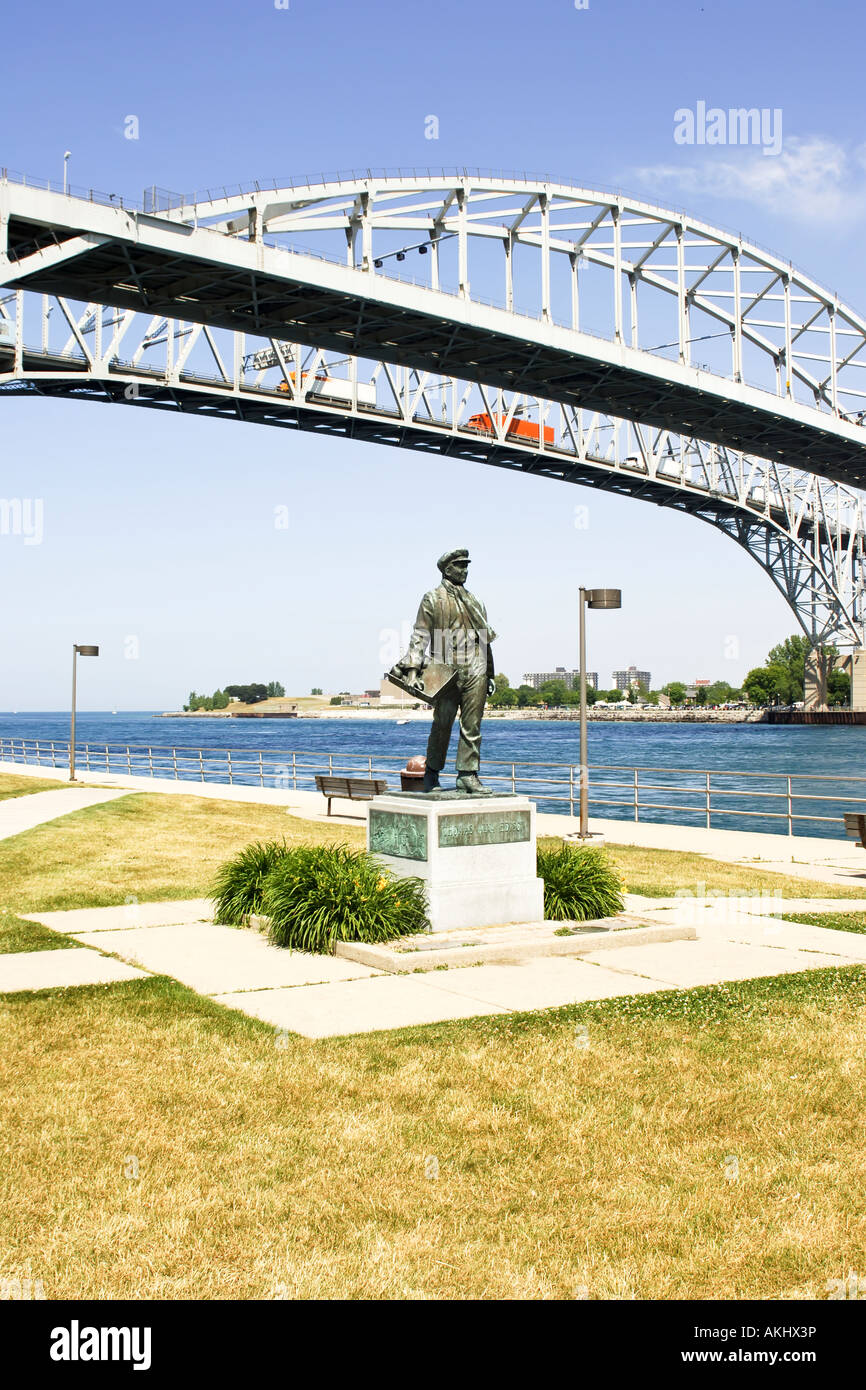 Statue of Thomas Edison stands below the Blue Water Bridge in Port ...