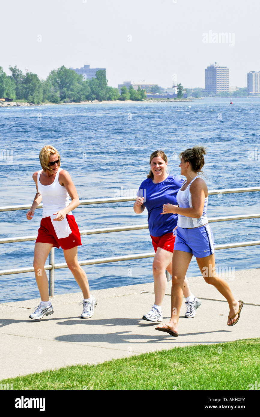 Group of adult females jogging along the St Clair river waterfront ...