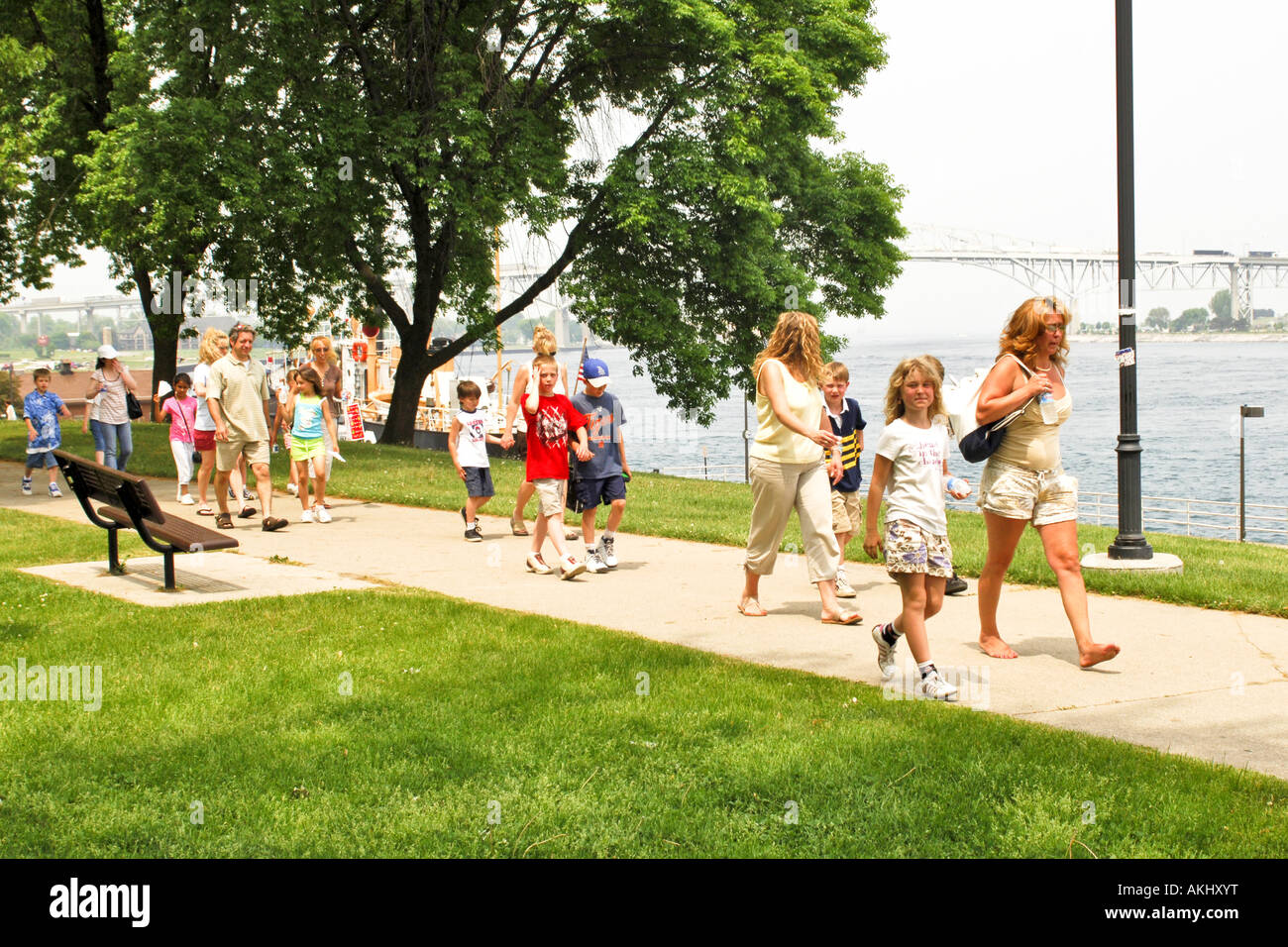 School group of young children being supervised on a field trip to Port ...