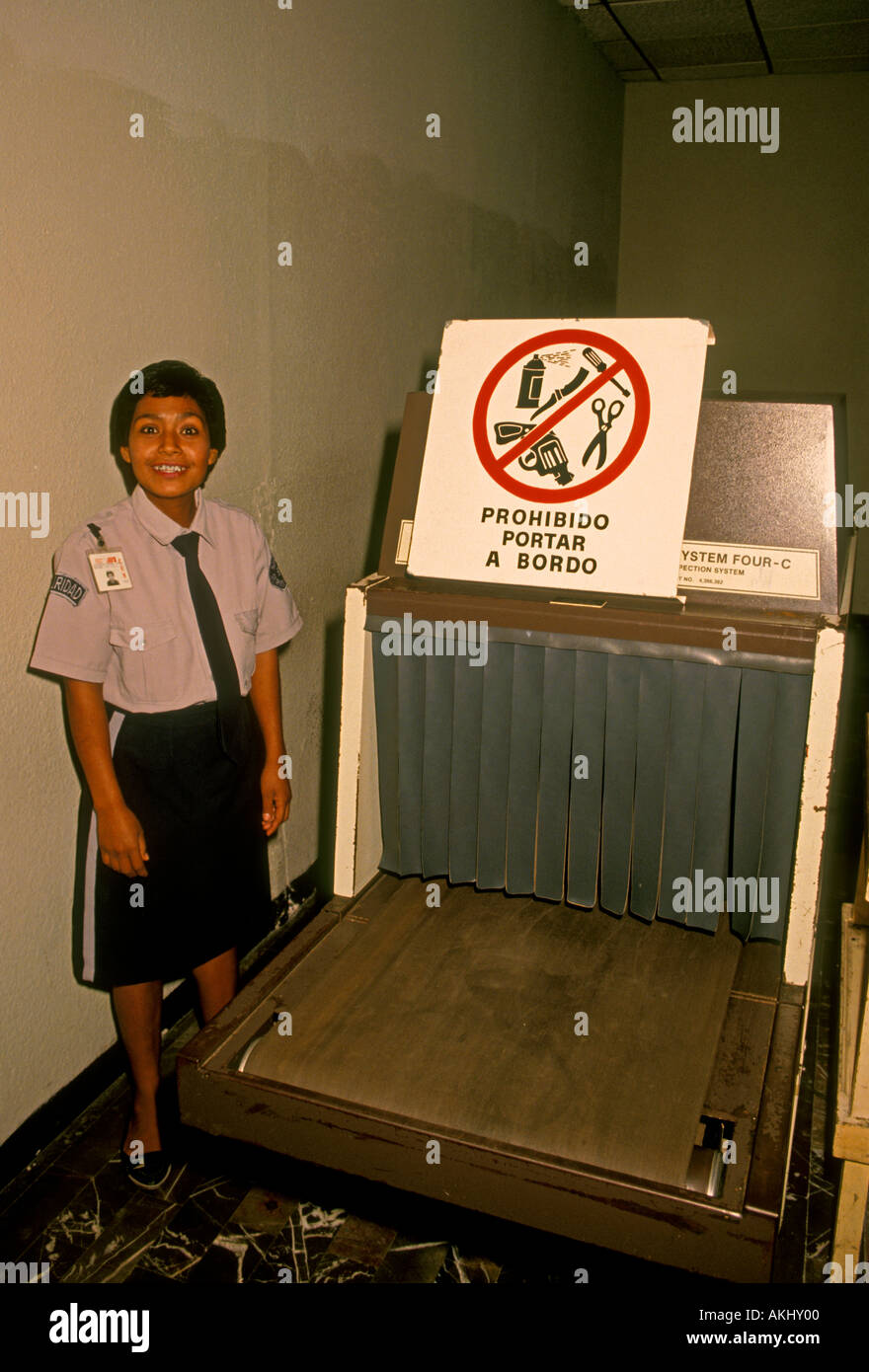 Mexican woman, female security guard, security checkpoint, xray machine ...