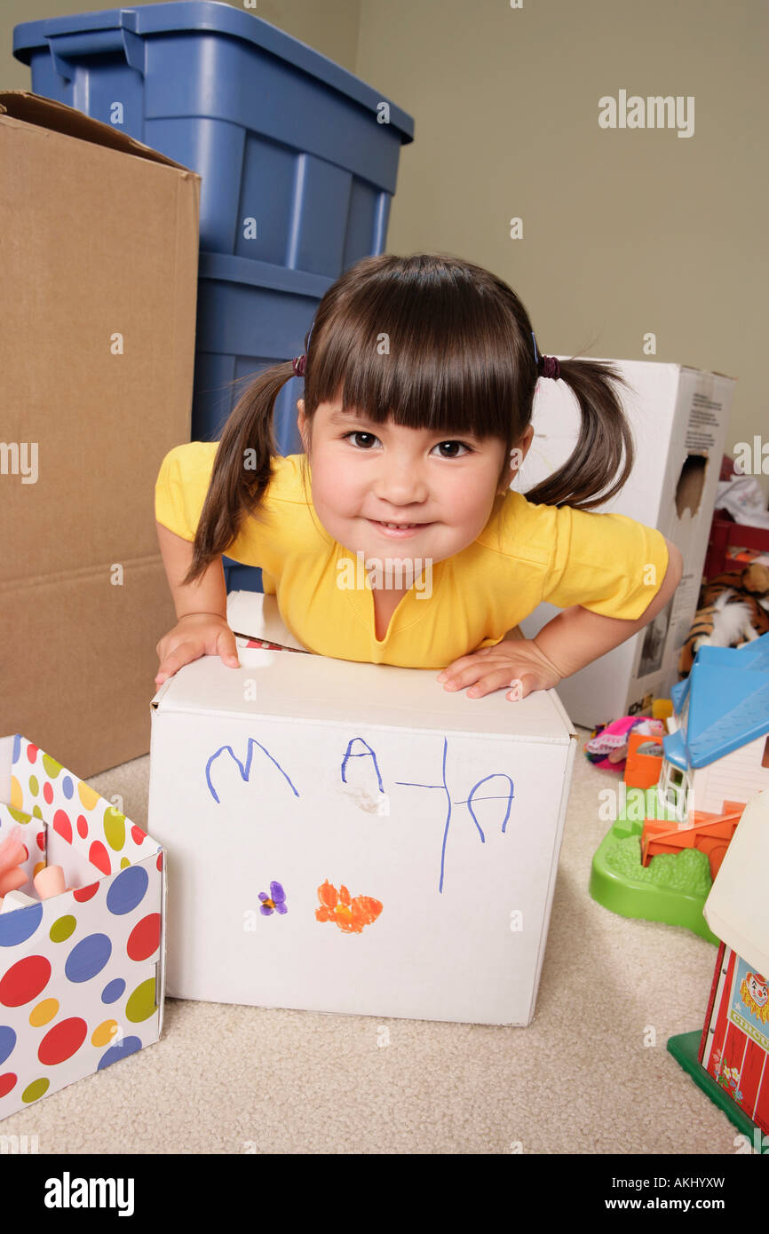 Front view of girl with box Stock Photo - Alamy