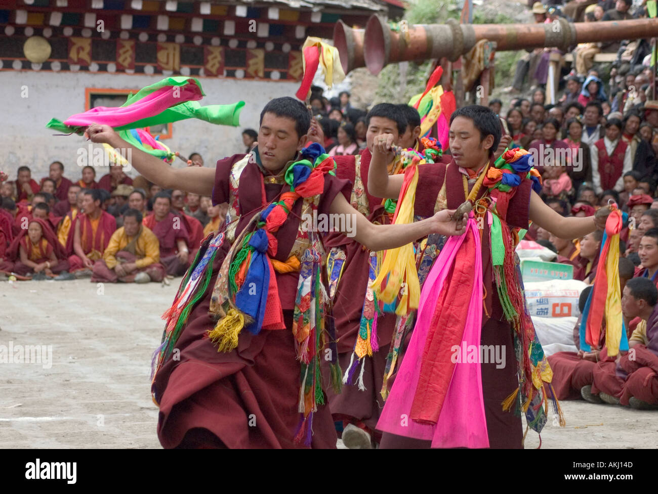 Monks dance with ribbons representing deity powers at the Monlam Chenmo ...