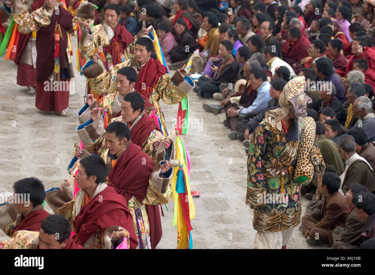 Monks dance with ribbons representing deity powers at the Monlam Chenmo ...