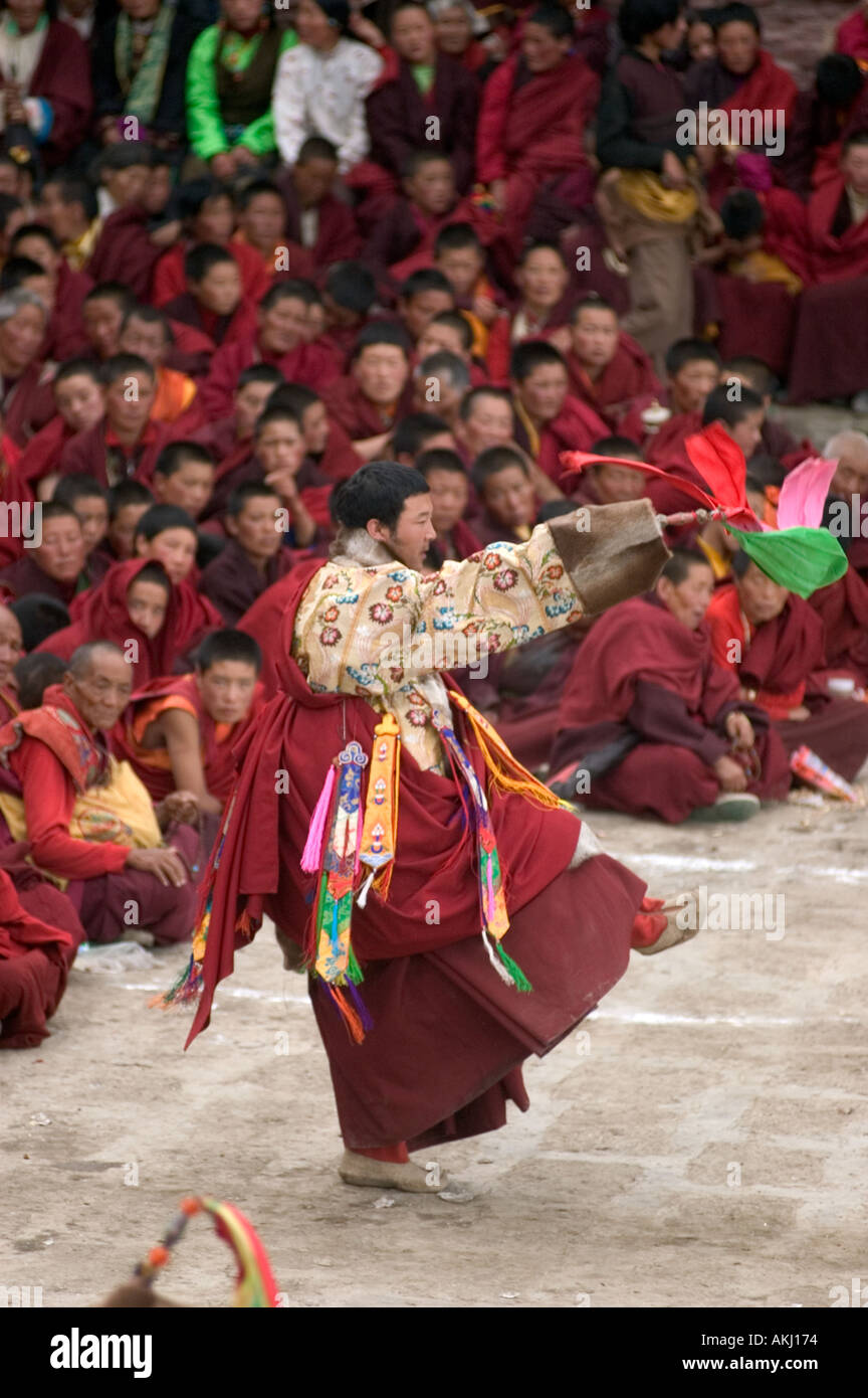 Monks dance with ribbons representing deity powers at the Monlam Chenmo ...