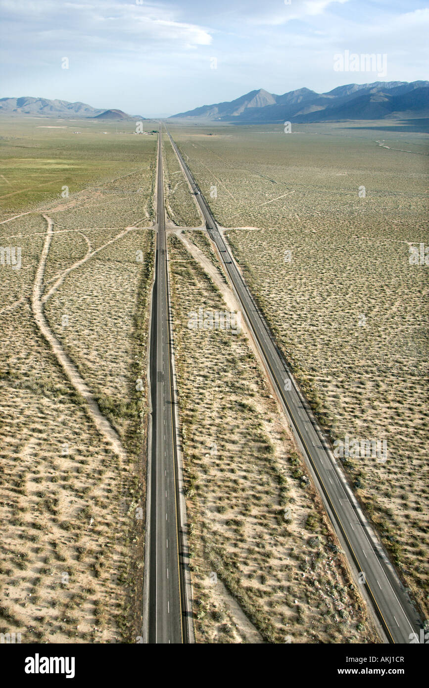 Aerial of desolate scenic highway through rural desert landscape of ...