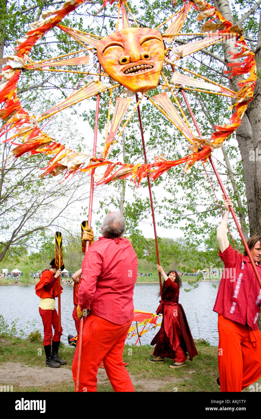 Puppeteers with sun awakening spring and Tree of Life. MayDay Parade ...