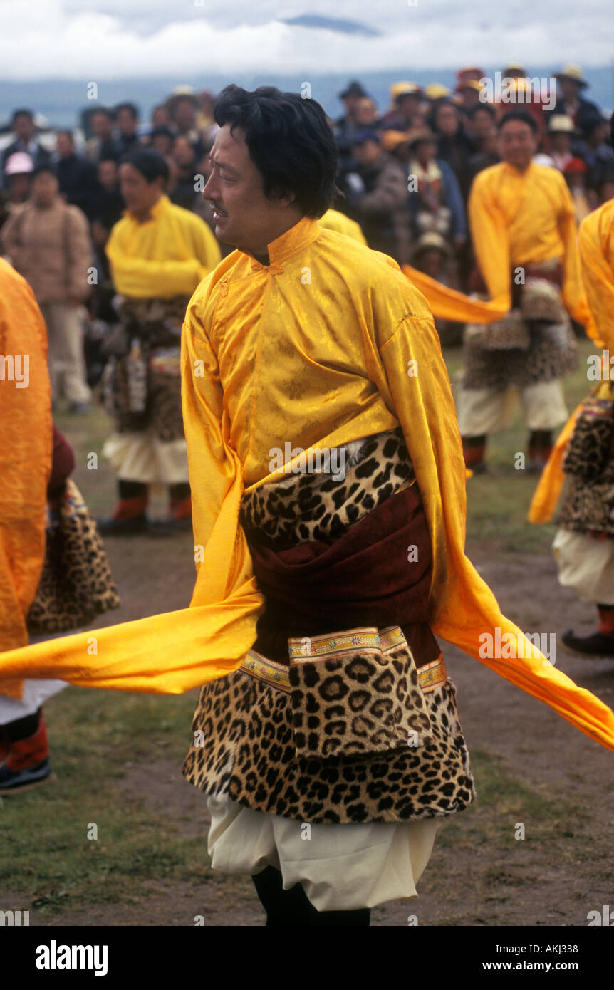 Male dancer with leopard skin costume representing a region of Kham ...