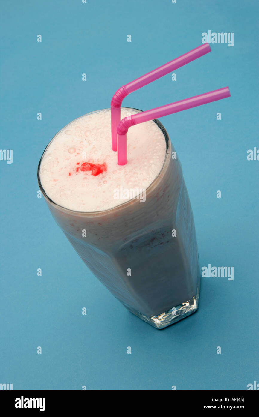 Milkshake with two straws Stock Photo - Alamy