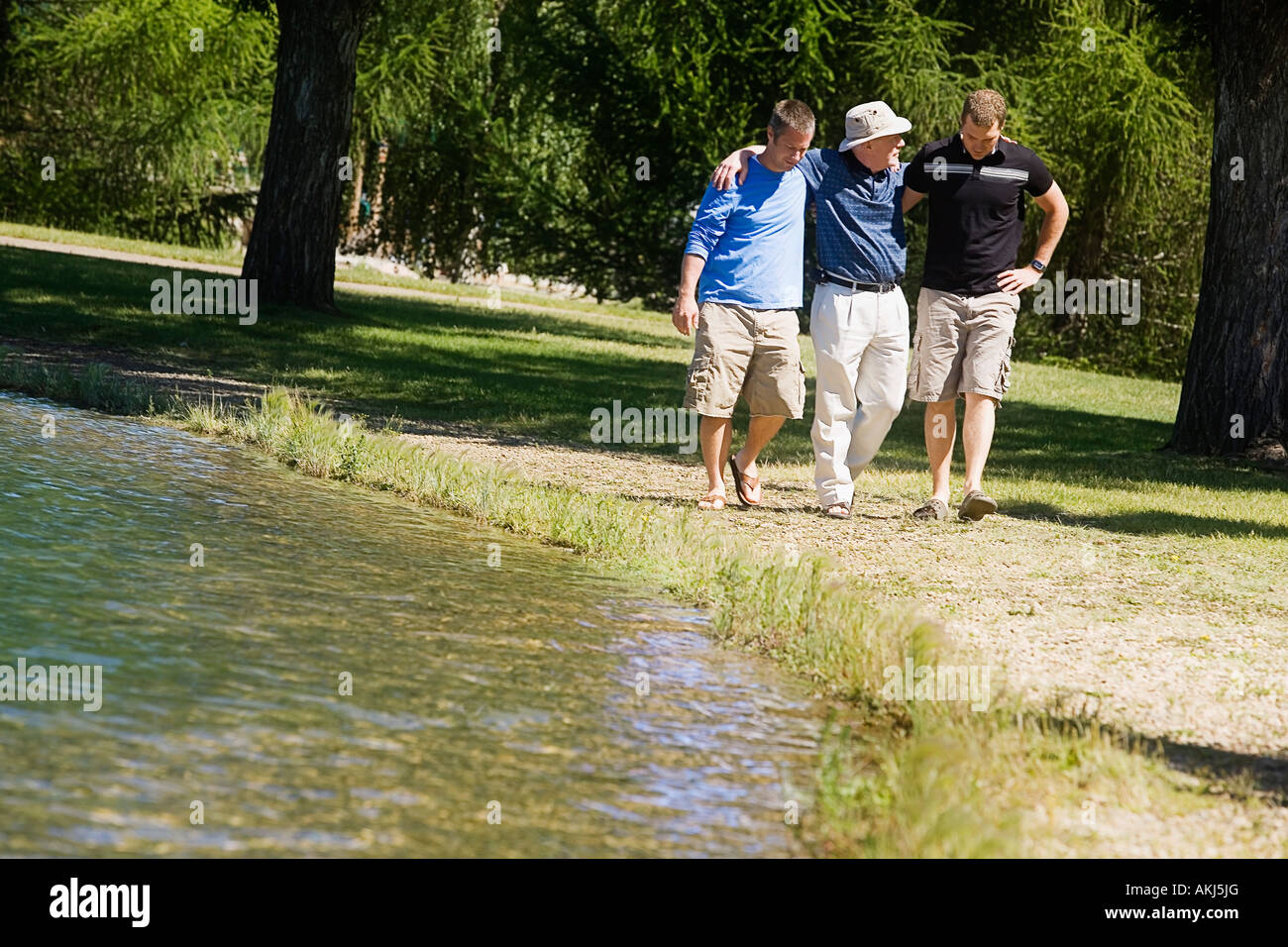 Men walking in the park Stock Photo - Alamy