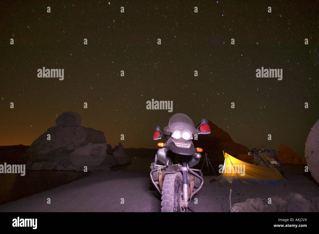 Motorcycle campsite against a clear starry night in California USA ...