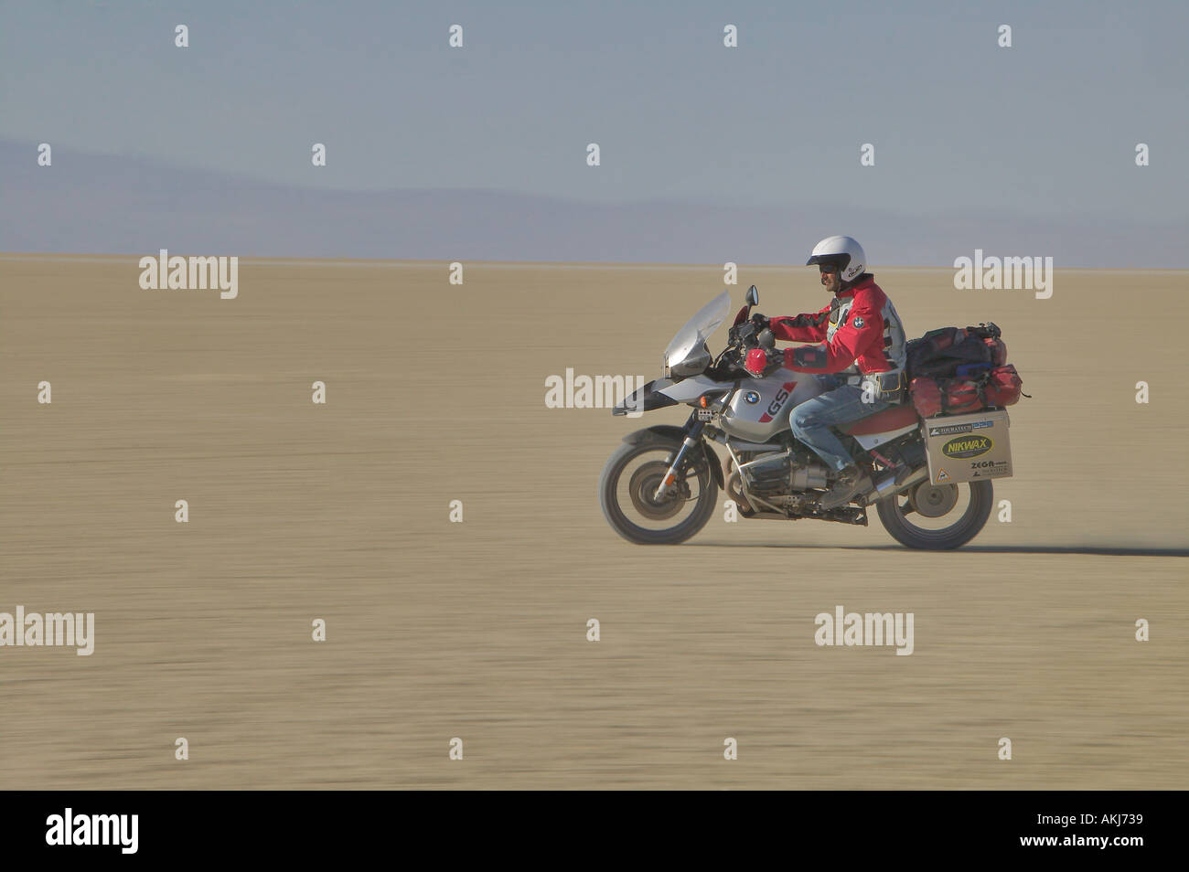 Motorcyclist riding in the Black Rock Desert Nevada USA Stock Photo - Alamy