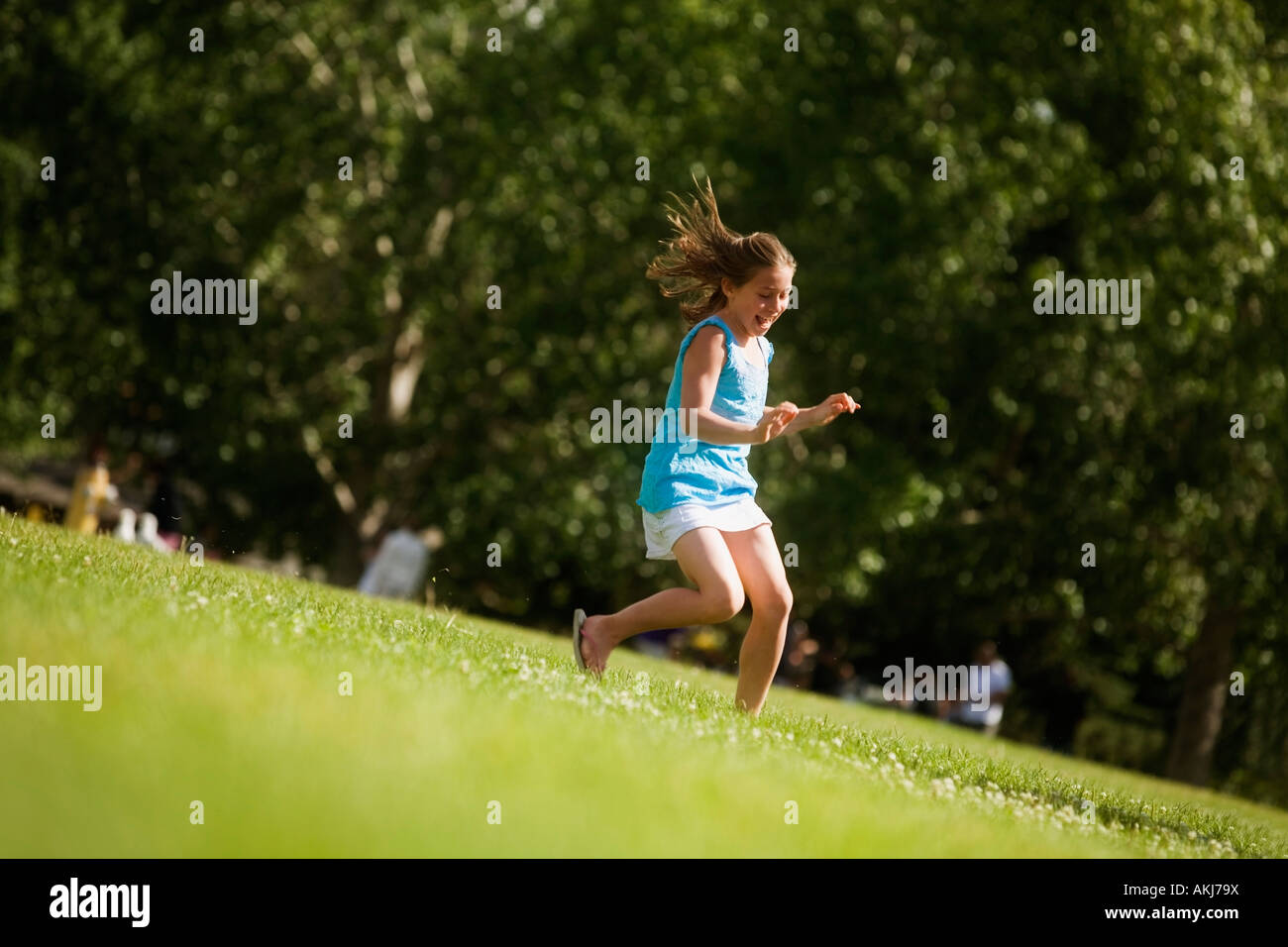 Girl running in the park Stock Photo - Alamy