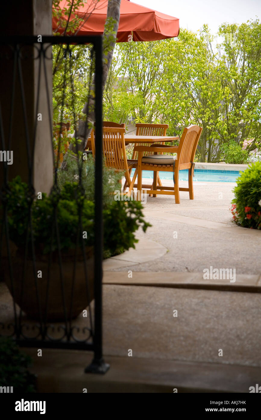 View down path to sitting area beside pool Stock Photo - Alamy