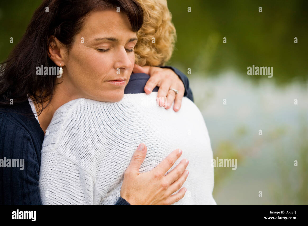 Two people embracing Stock Photo - Alamy