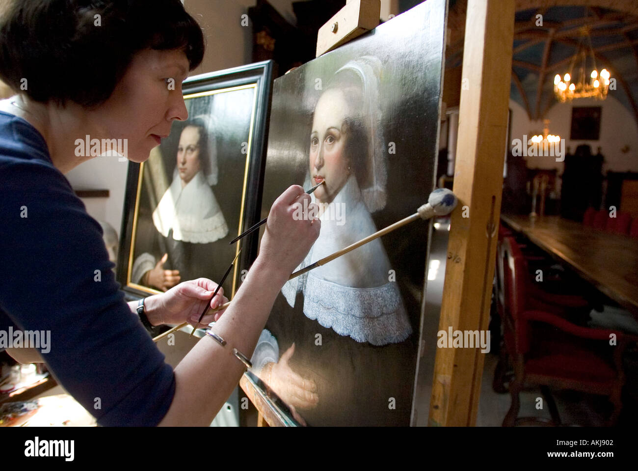 Artist replicating a painted masterpiece by hand at a museum in Krakow ...