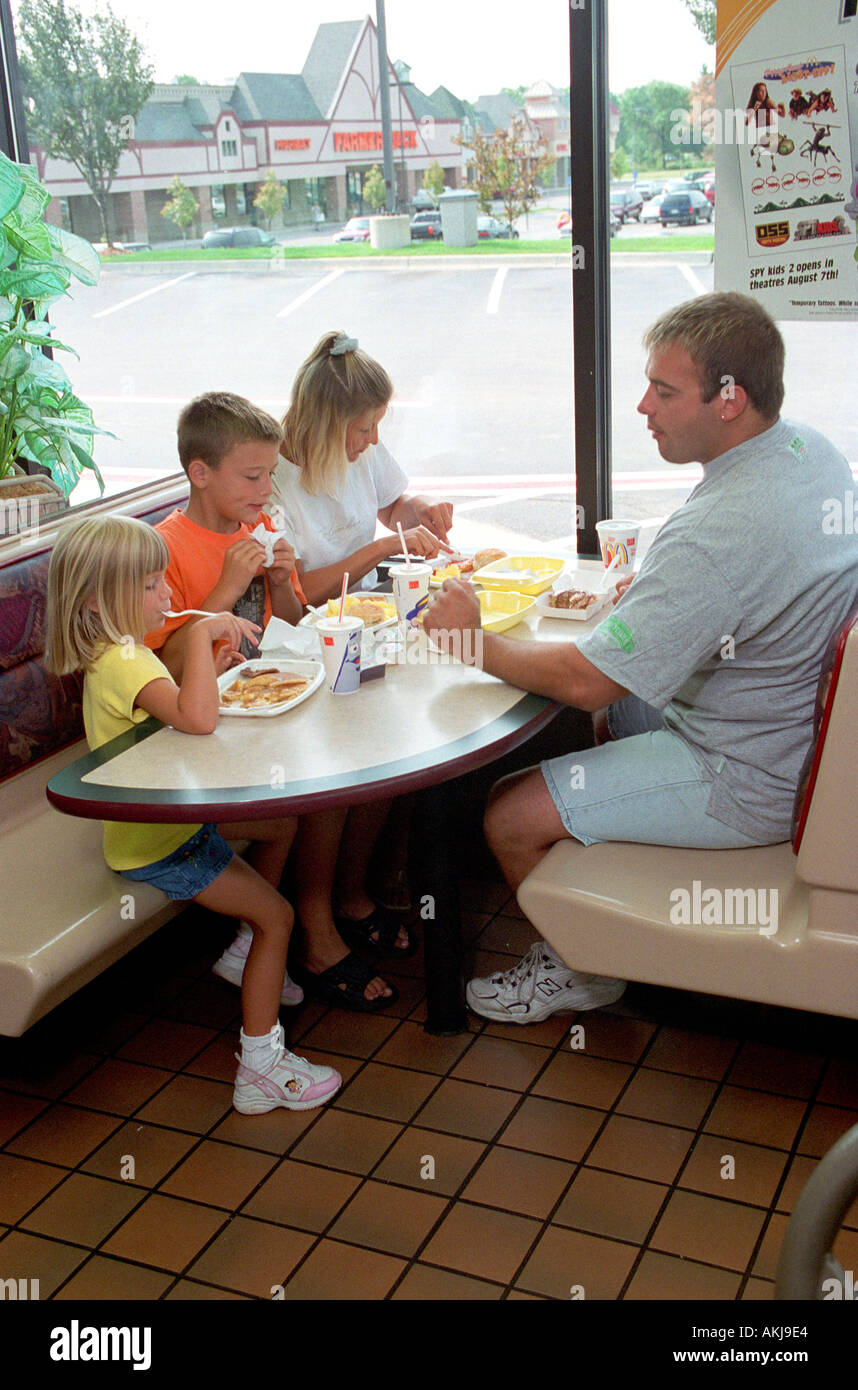 Family eats food and McDonald s fast food restaurant using plastic ...
