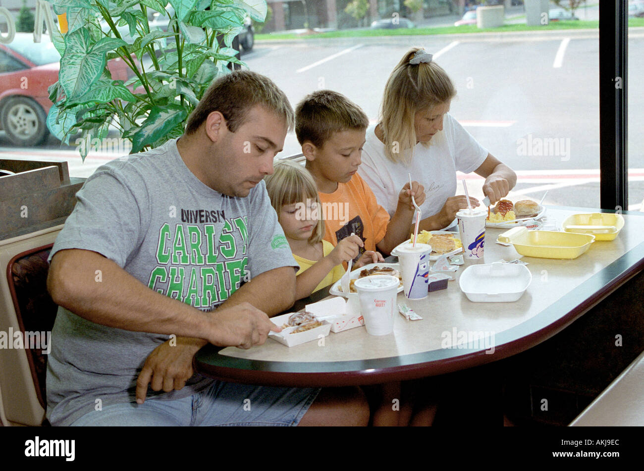 Family eats food and McDonald s fast food restaurant using plastic ...