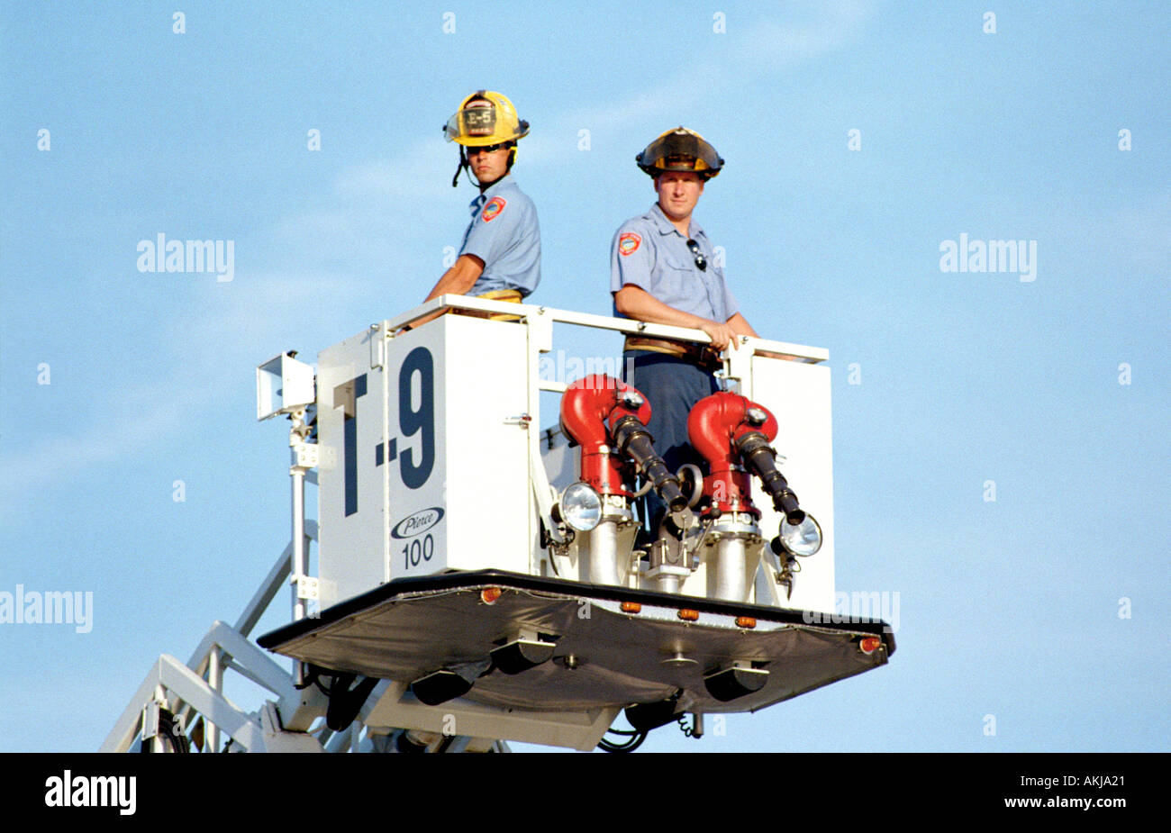 Firefighters demonstrate the use of a extended ladder and boom as part ...
